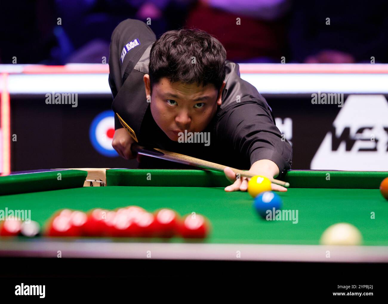 Zhang Anda during his match against Judd Trump (not pictured) on day ...