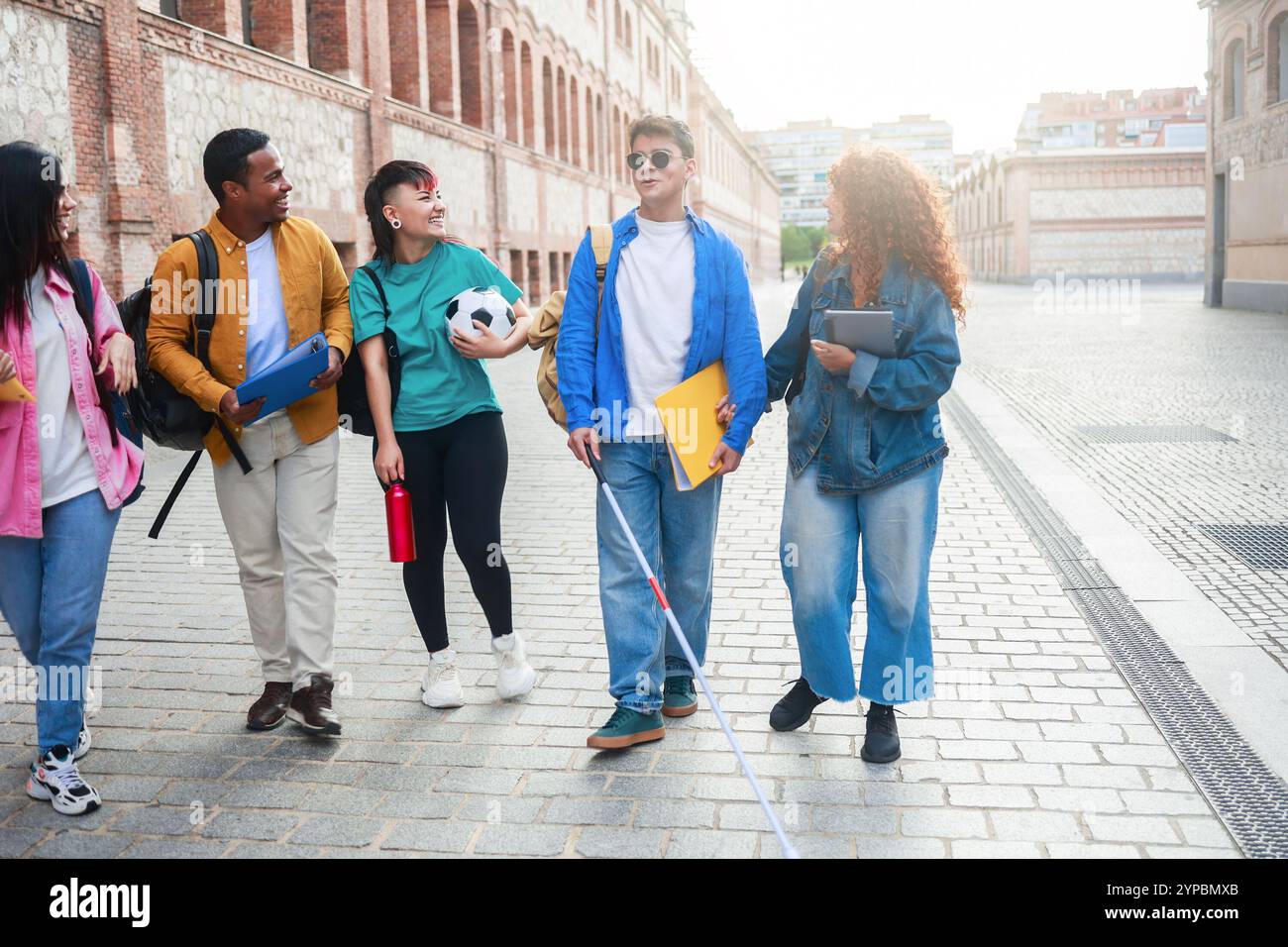 Disability blind, Diverse group of friends having fun outside college ...