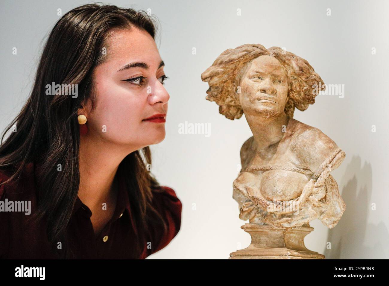 London, UK. 28th Nov, 2024. Staff with 'Why Be Born A Slave' by artist ...