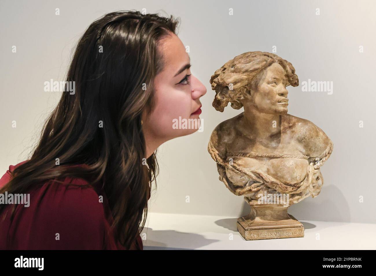 London, UK, 28th Nov 2024. Staff with 'Why Be Born A Slave' by artist ...