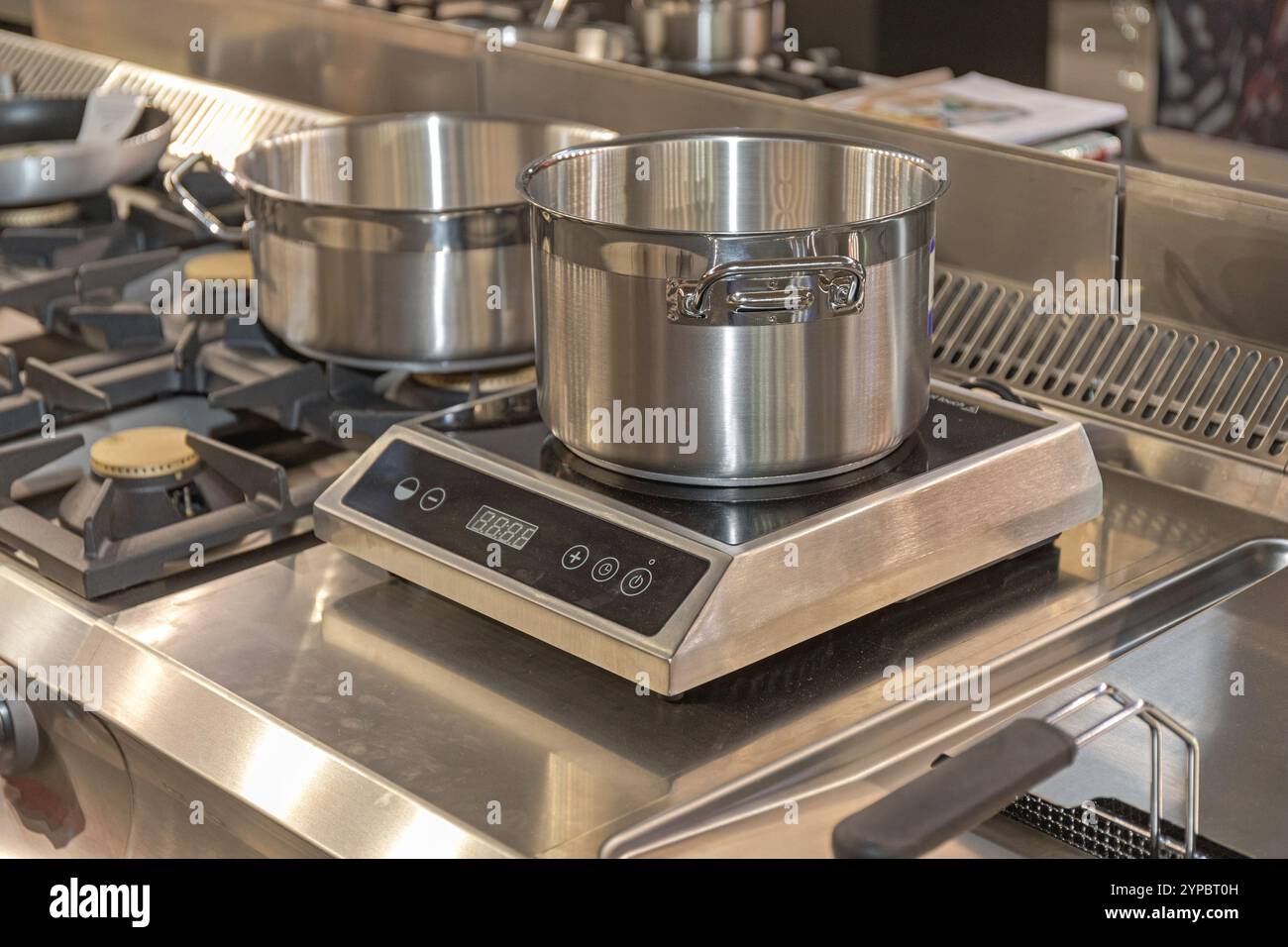 Stainless Steel Pot at Single Induction Cooker Professional Kitchen ...