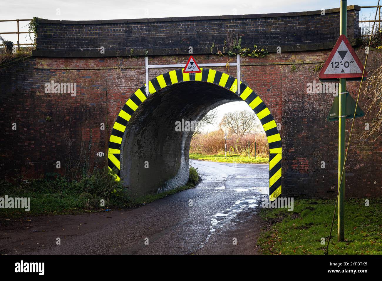 Yellow black striped road sign hi-res stock photography and images - Alamy