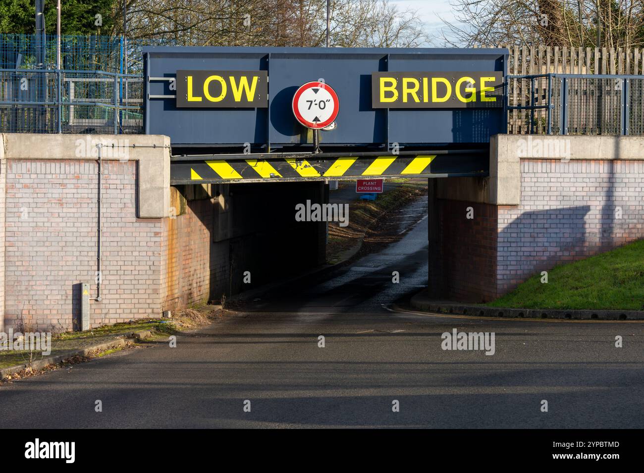 Low bridge warning sign with height restriction information for ...