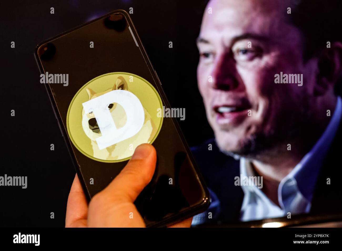 In this photo illustration, the Dogecoin logo is seen displayed on a ...