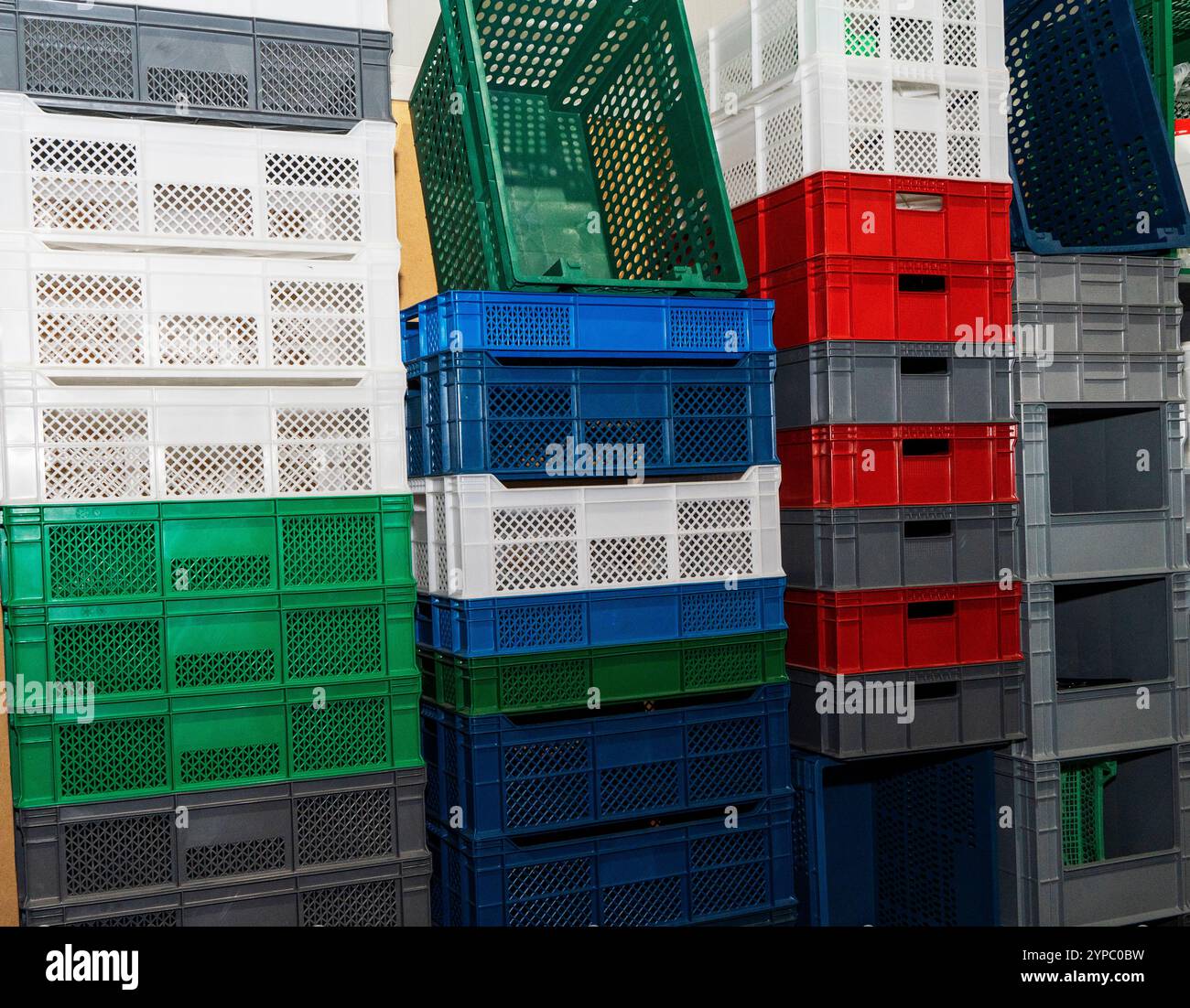 Large multi-colored plastic boxes for goods and products stand as a ...