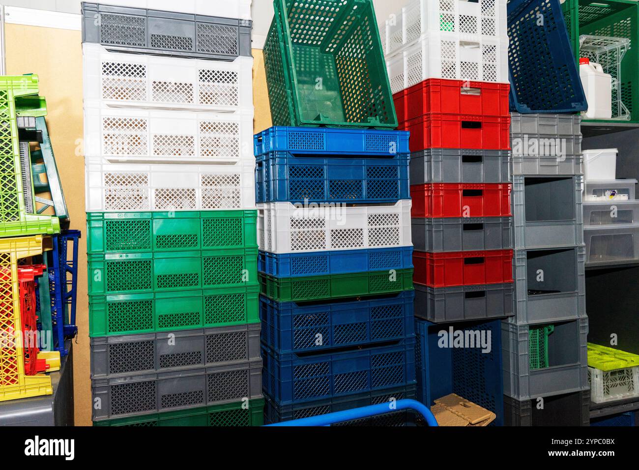 Large multi-colored plastic boxes for goods and products stand as a ...