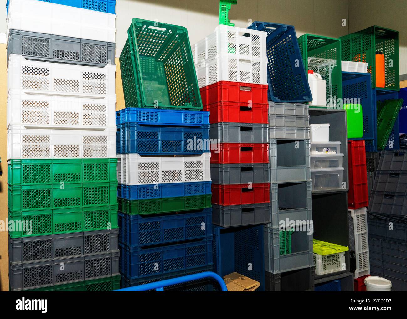 Large multi-colored plastic boxes for goods and products stand as a ...