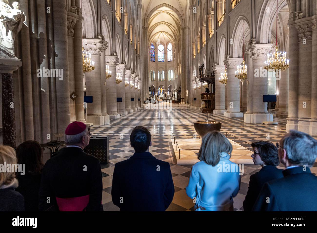 French President Emmanuel Macron, center, and his wife Brigitte Macron ...