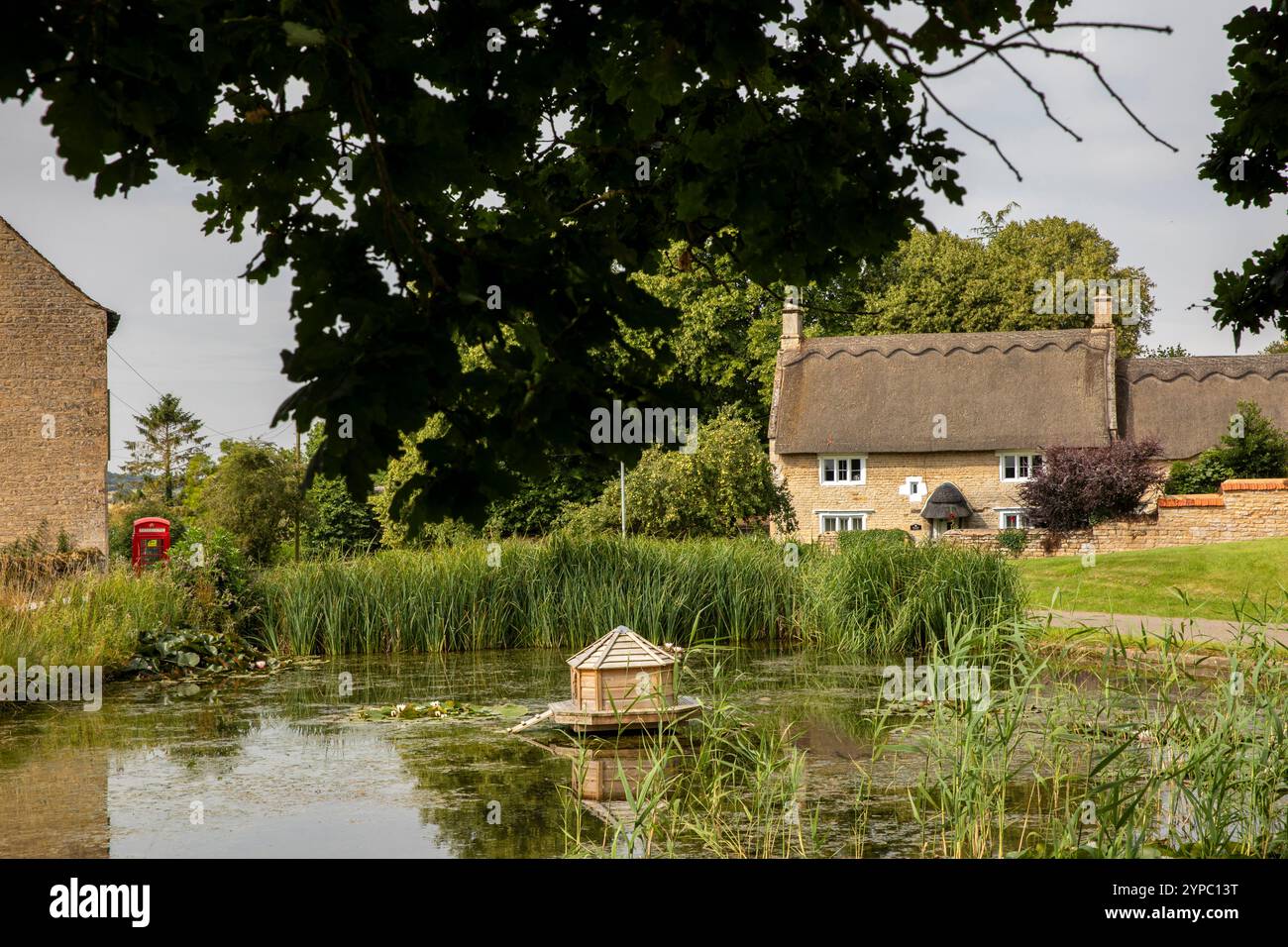 UK, England, Rutland, Barrowden, village pond with duck house Stock ...