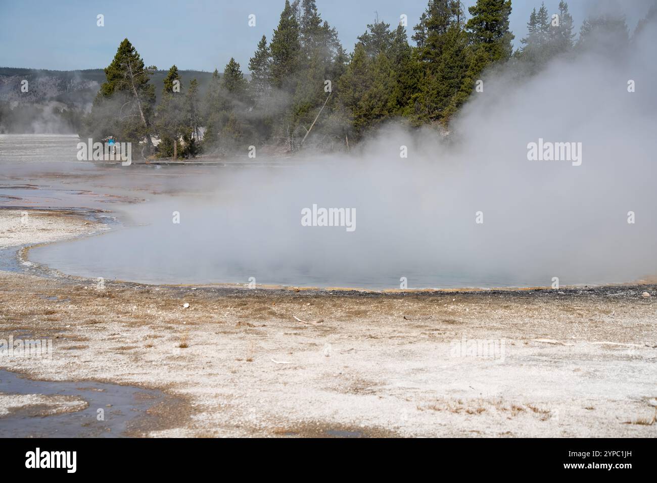 an active geyser spring with an intermittent discharge of water ejected ...