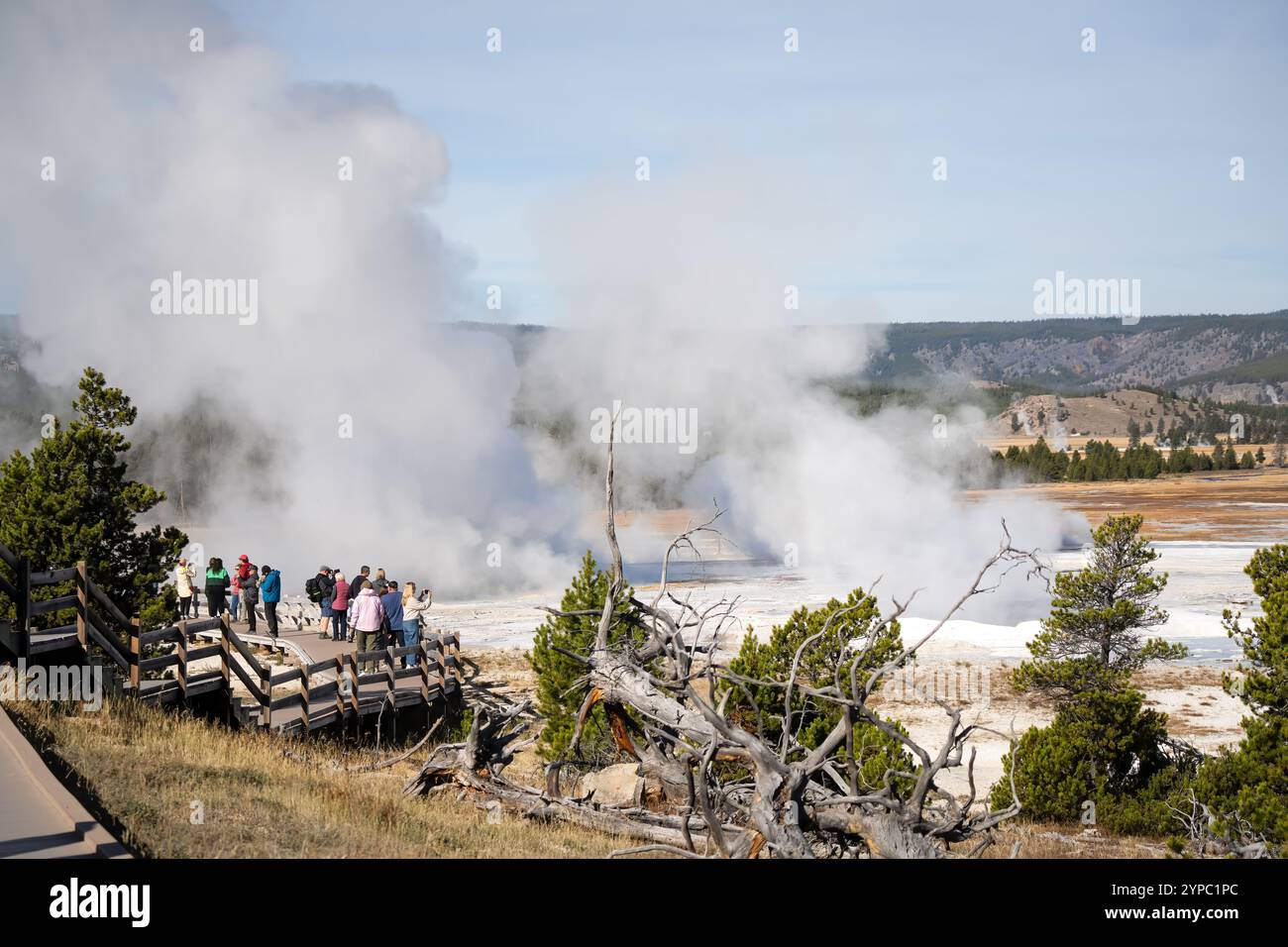 an active geyser spring with an intermittent discharge of water ejected ...