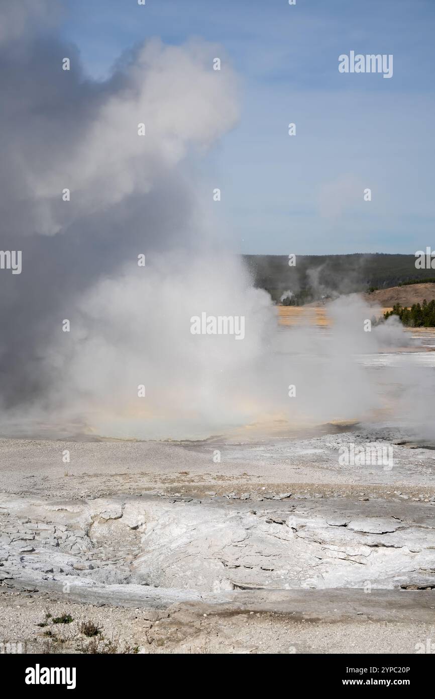 an active geyser spring with an intermittent discharge of water ejected ...