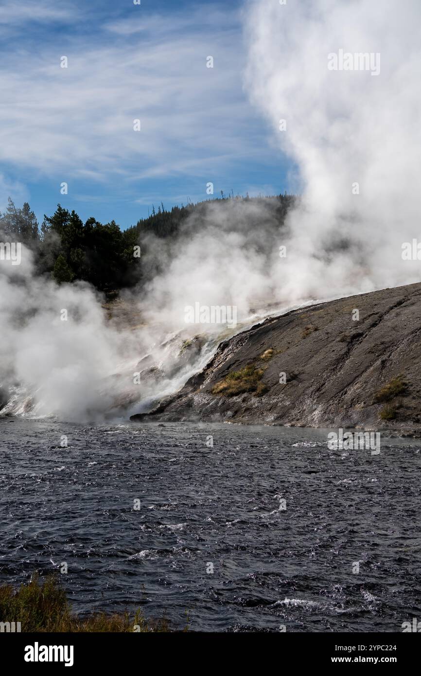 an active geyser spring with an intermittent discharge of water ejected ...