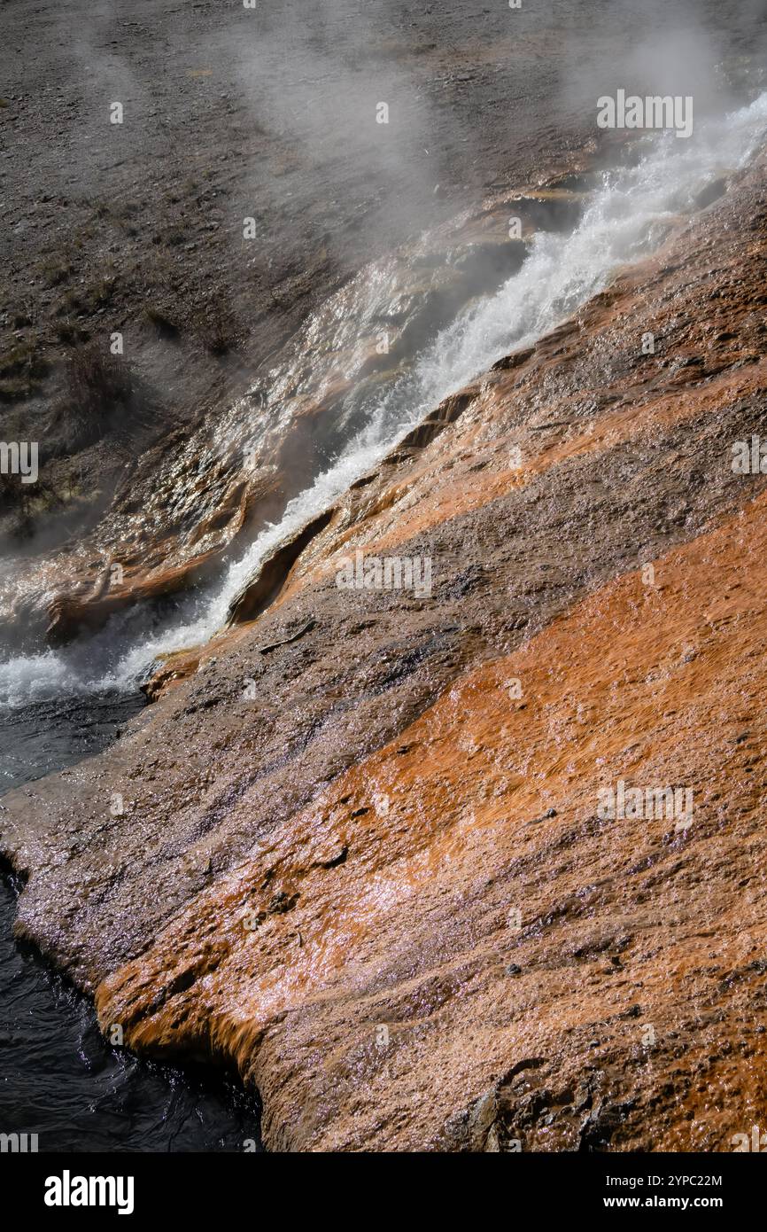 an active geyser spring with an intermittent discharge of water ejected ...