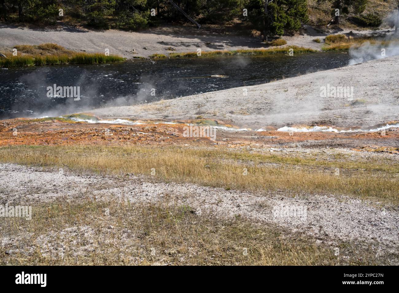 an active geyser spring with an intermittent discharge of water ejected ...