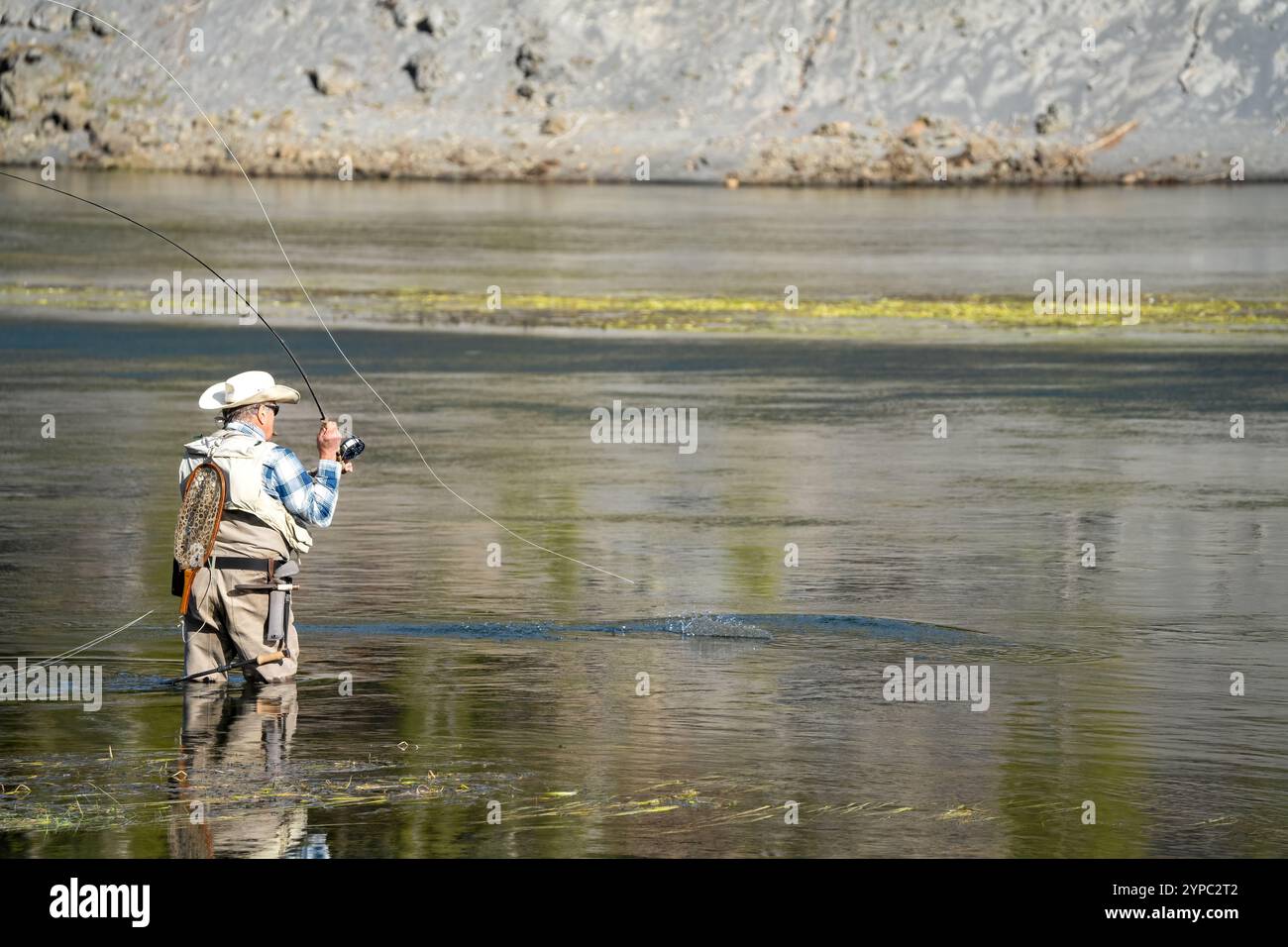 Angler in chest waders hi-res stock photography and images - Alamy
