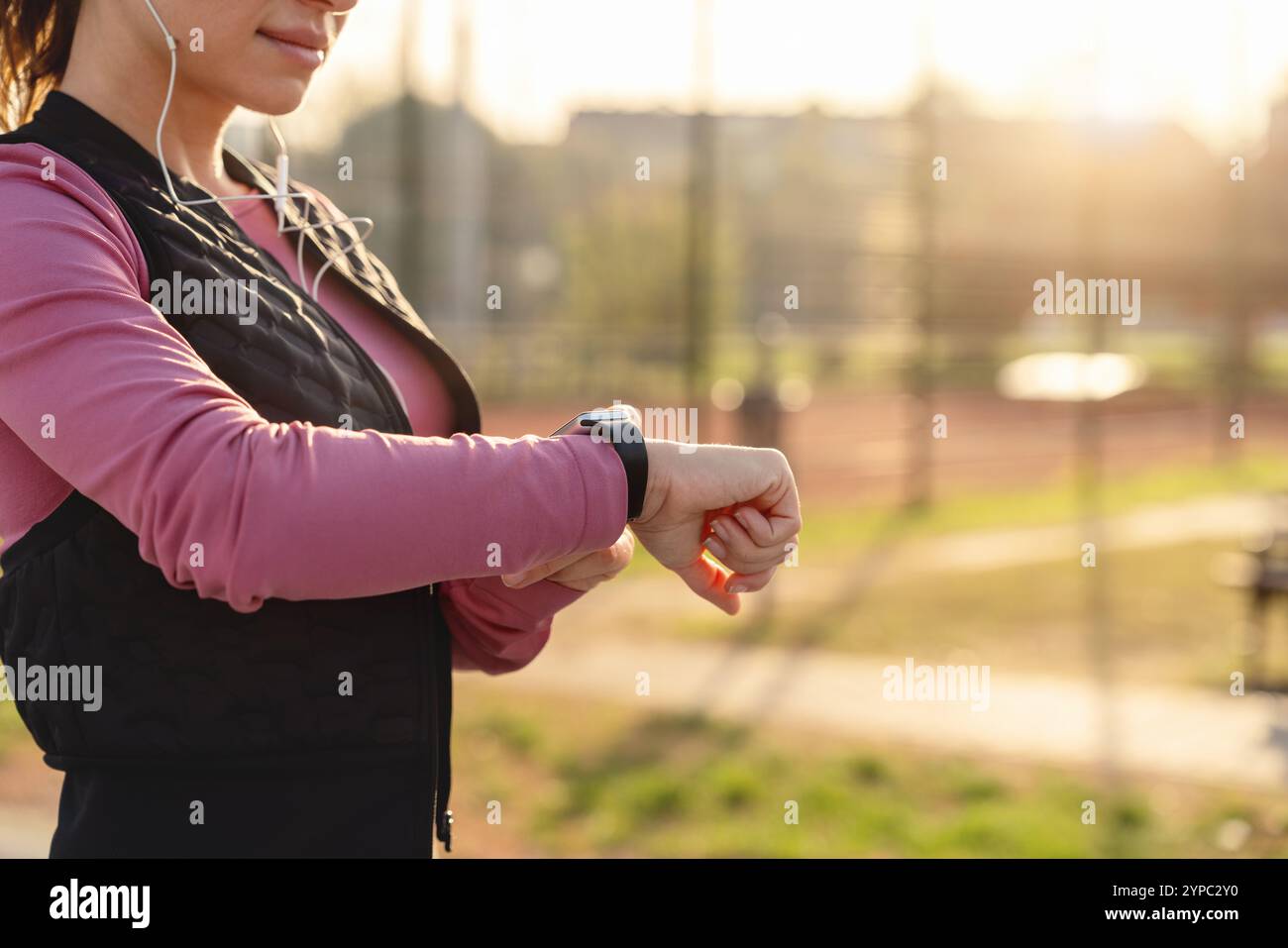 Female athlete using modern devices hi-res stock photography and images ...