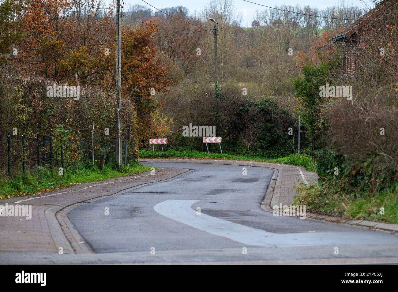 Bending street through the countryside in Oud-Heverlee, Leuven, Belgium ...