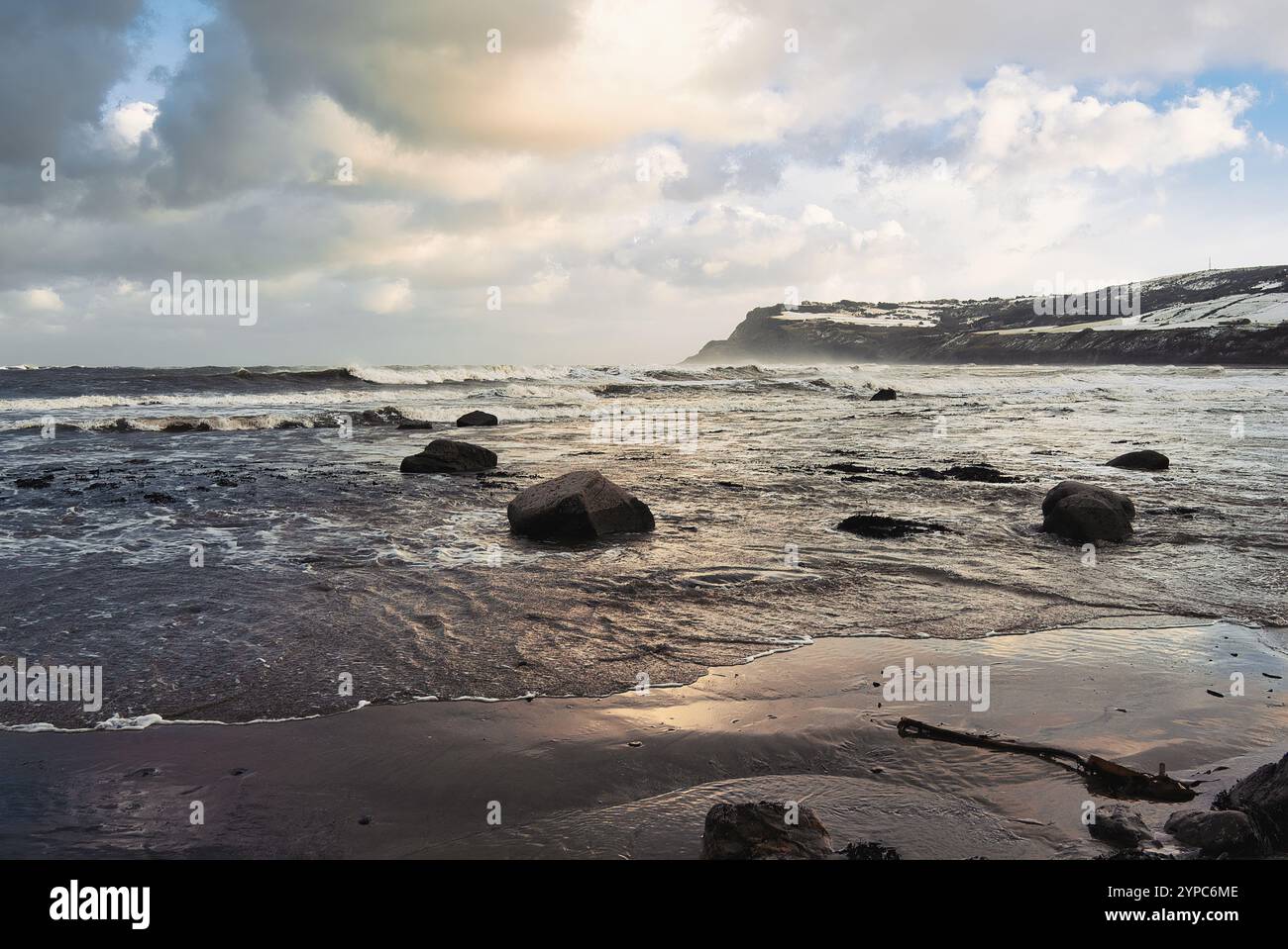 Strong winds create a wild sea and crashing waves on the Yorkshire ...