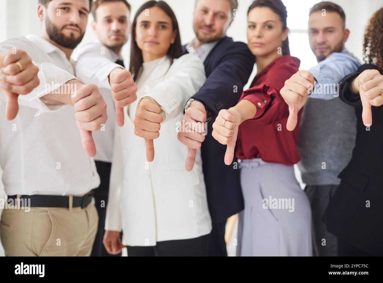 Dissatisfied sad angry bored unhappy young team, client group giving ...