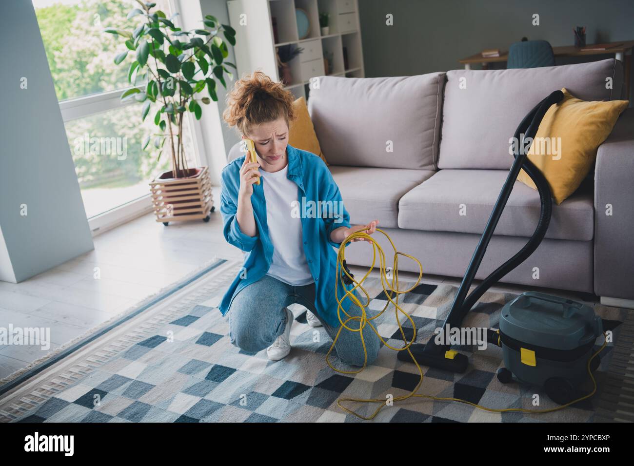 Full body photo of ginger young girl nervous repair vacuum cleaner talk ...