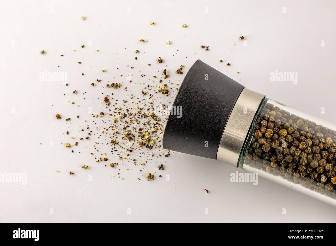 Salt and pepper in a glass container with a grinder, salt shaker ...