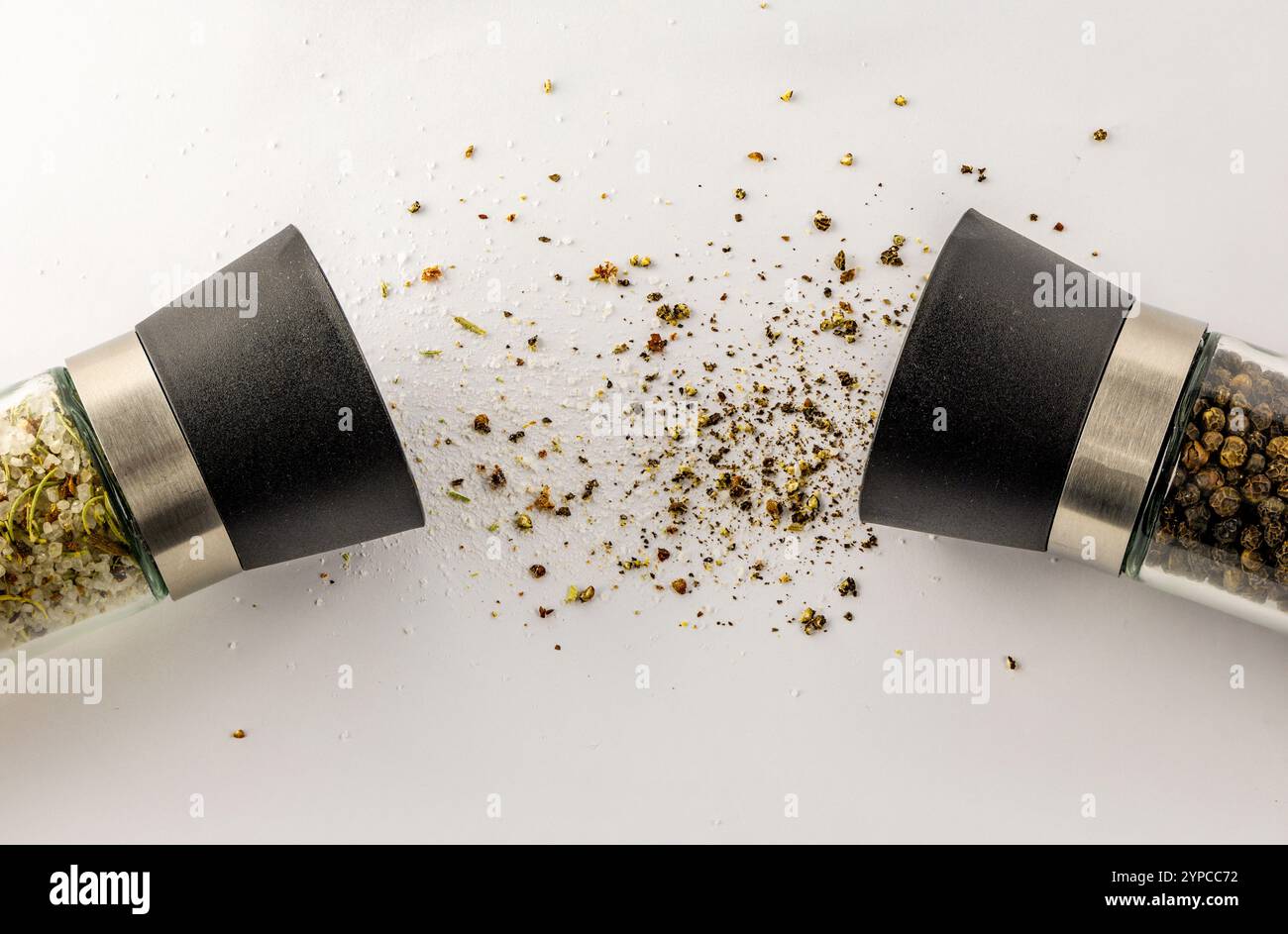 Salt and pepper in a glass container with a grinder, salt shaker ...