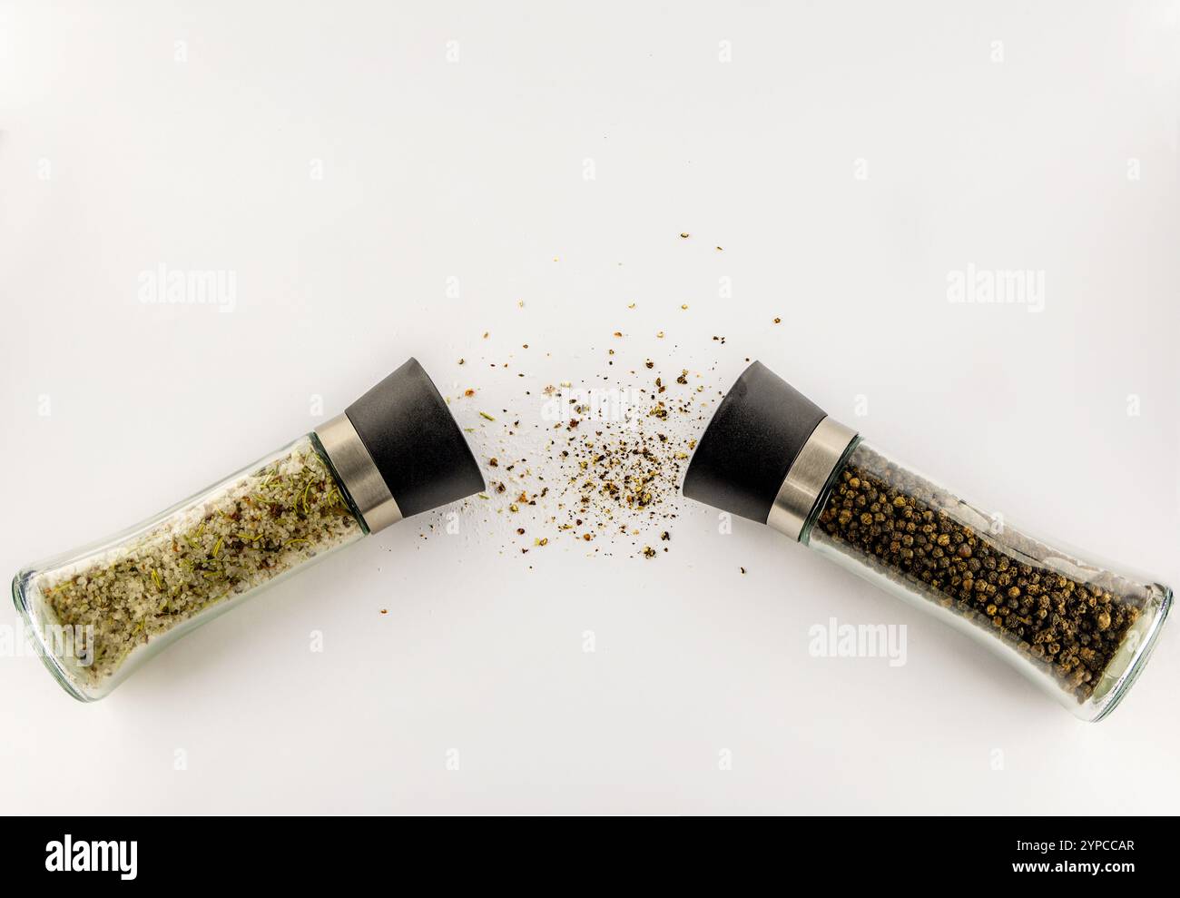 Salt and pepper in a glass container with a grinder, salt shaker ...
