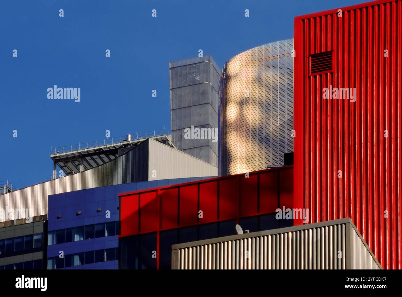 Sunlight creates interesting reflections on the metallic facades of ...