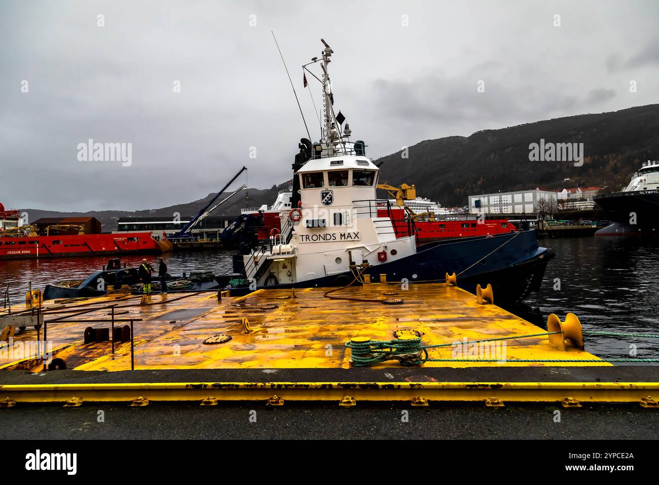 Tug boat Tronds Max with a floating quay at Tollboden quay, in the port of Bergen, Norway Stock ...