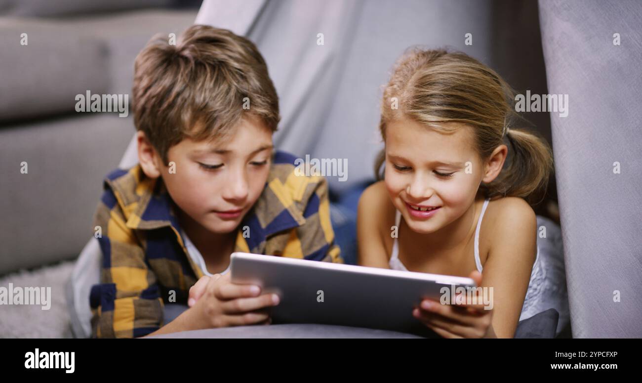 Children playing tablet home hi-res stock photography and images - Alamy