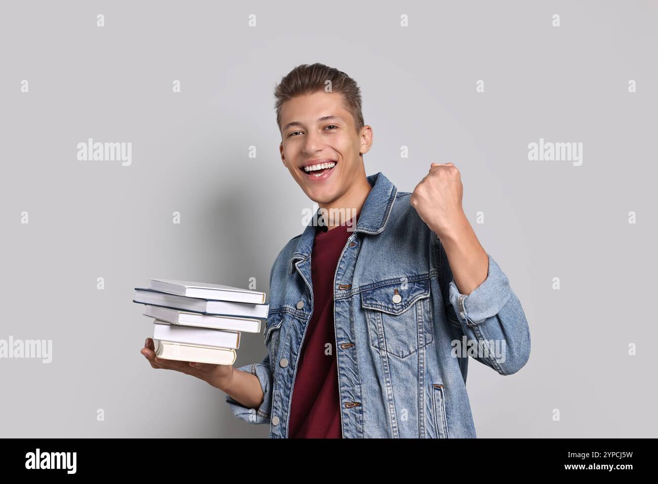 Emotional student stack books hi-res stock photography and images - Alamy