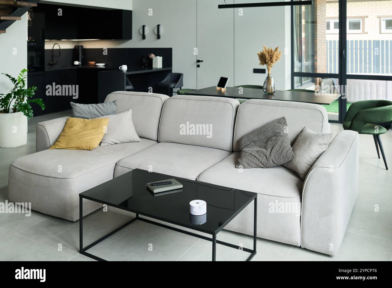 Modern living room setting with a comfortable sofa featuring pillows ...