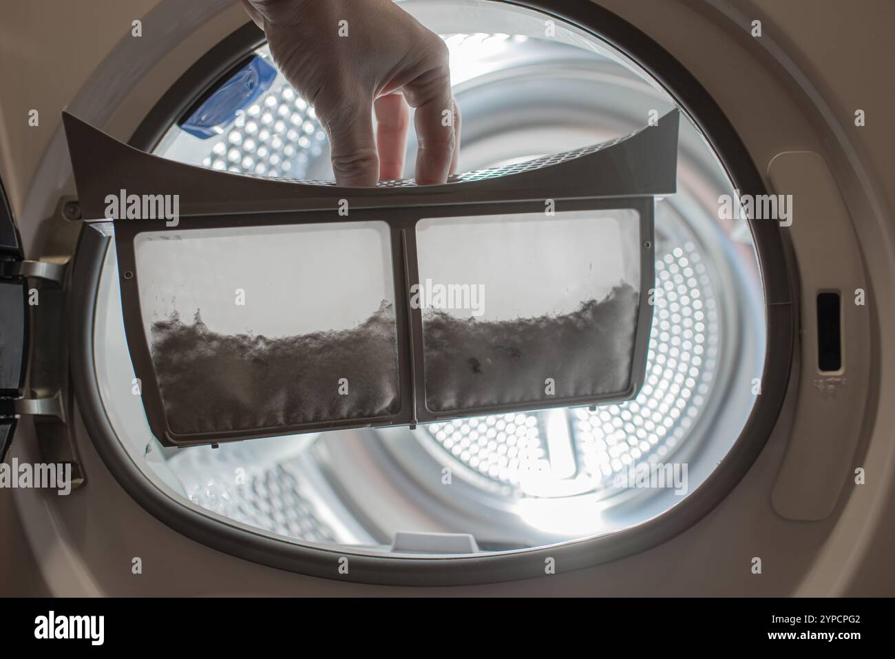 Dust and dirt trapped by the clothes dryer filter Stock Photo - Alamy