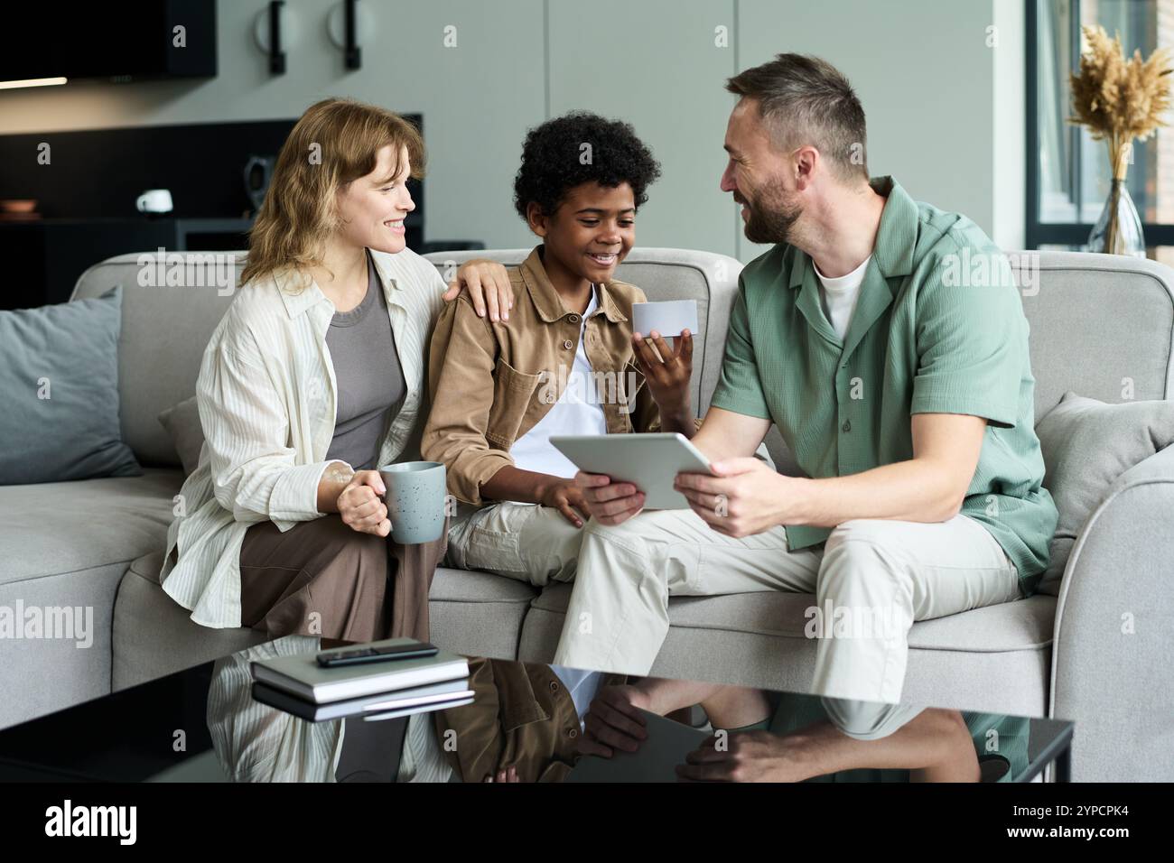 Modern multi ethnic family setting hi-res stock photography and images ...