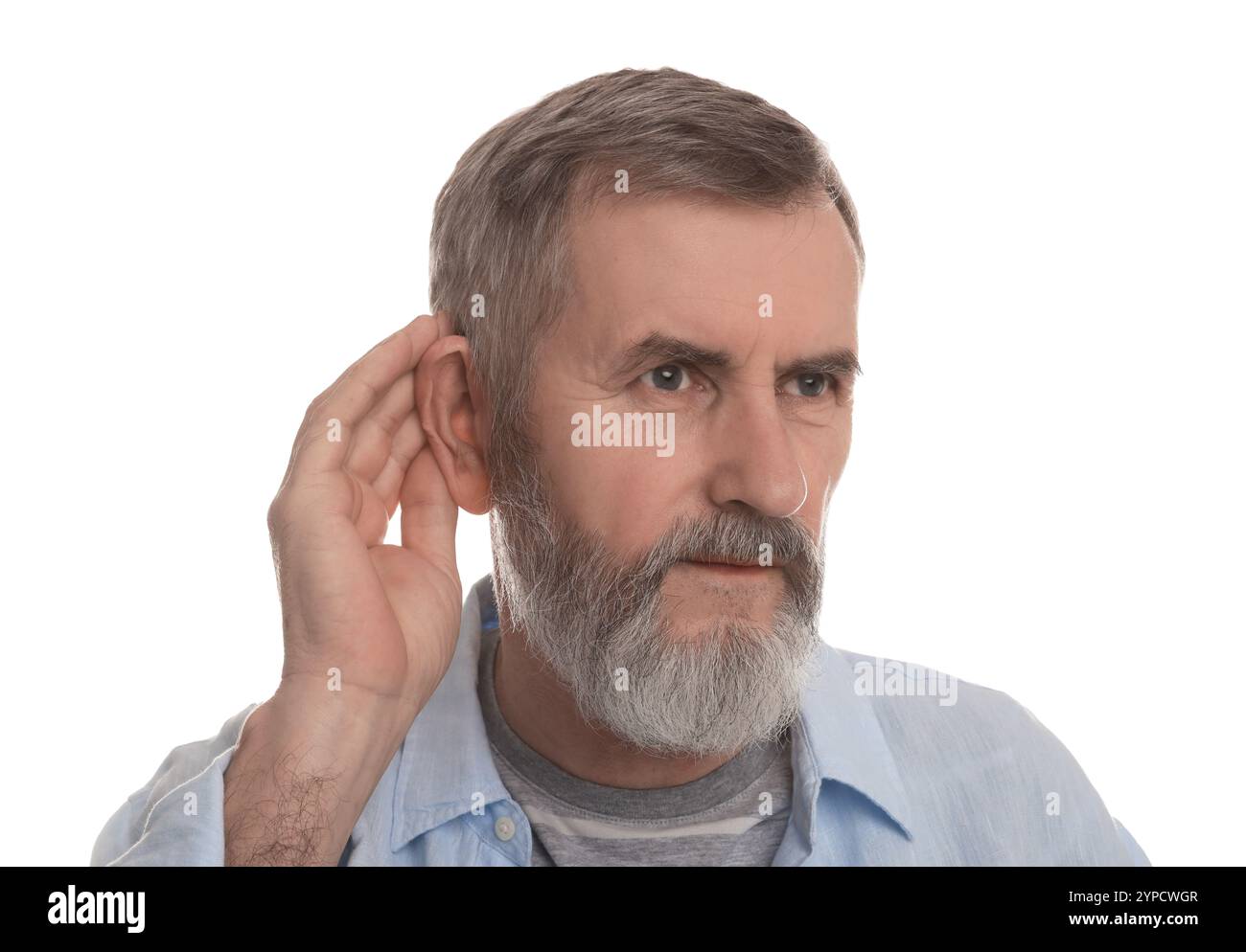 Senior man showing hand to ear gesture on white background Stock Photo ...