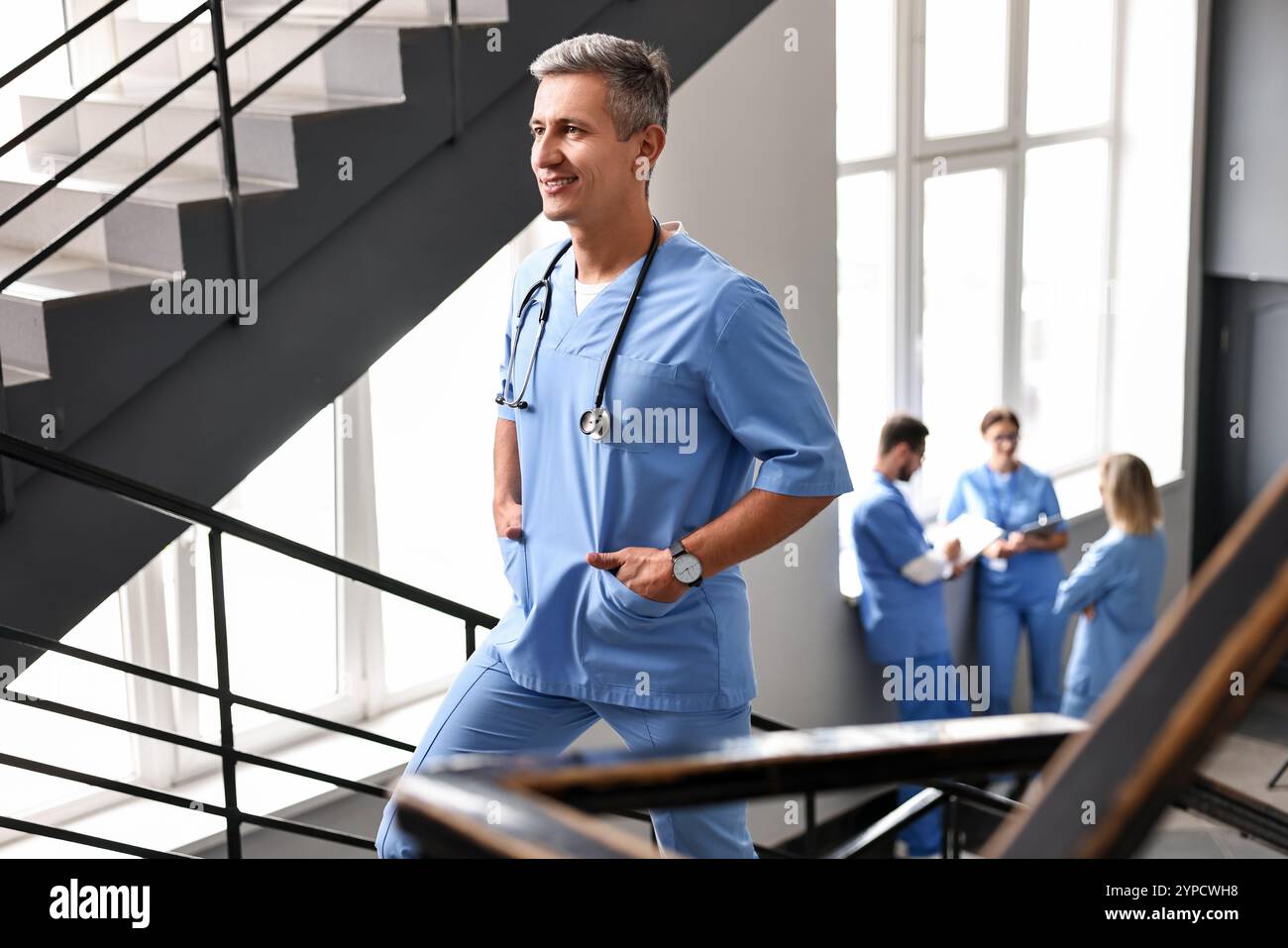 Doctor walking up stairs hi-res stock photography and images - Alamy