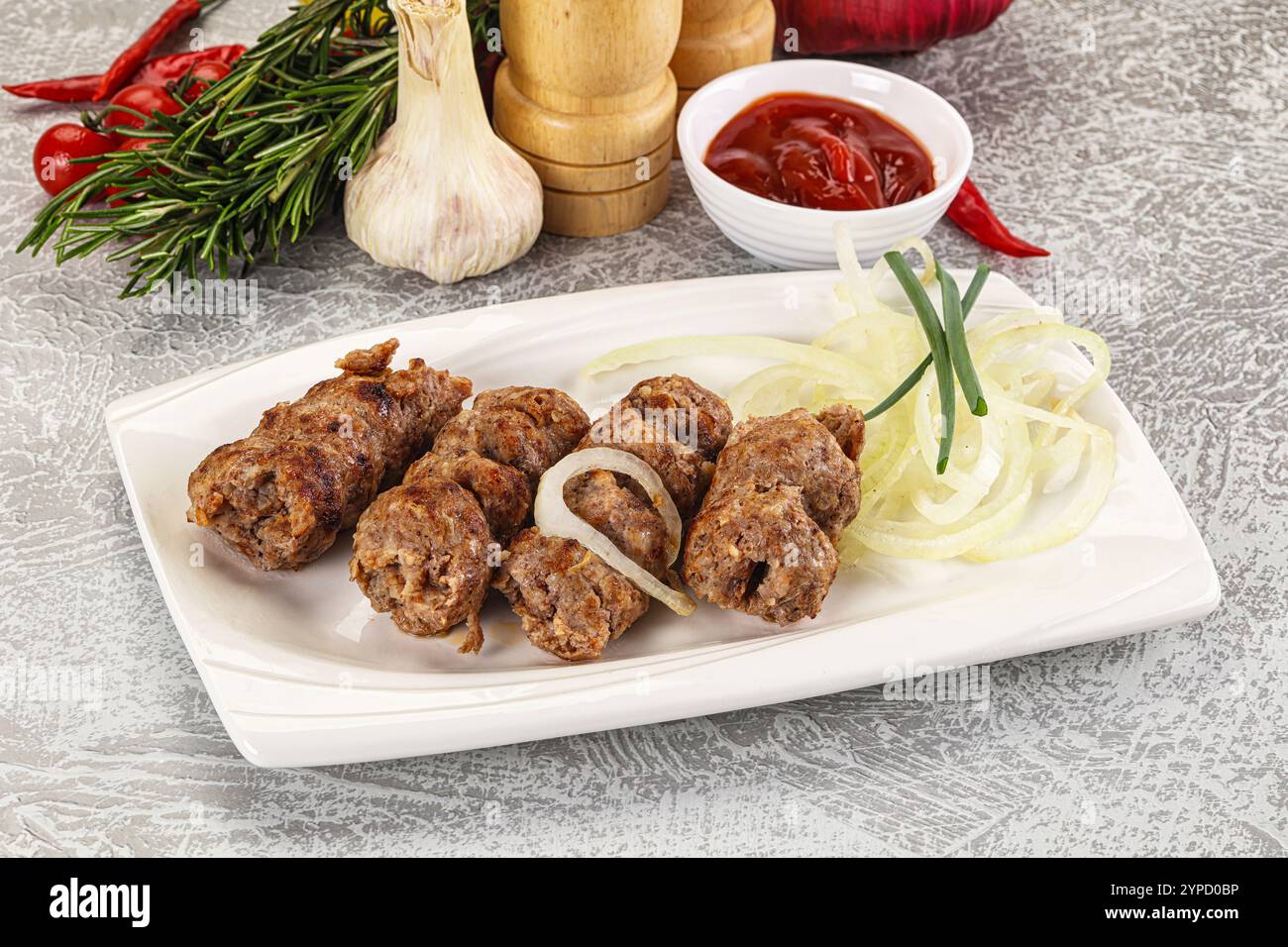 Beef kebab minced meat with sauce and onion Stock Photo - Alamy