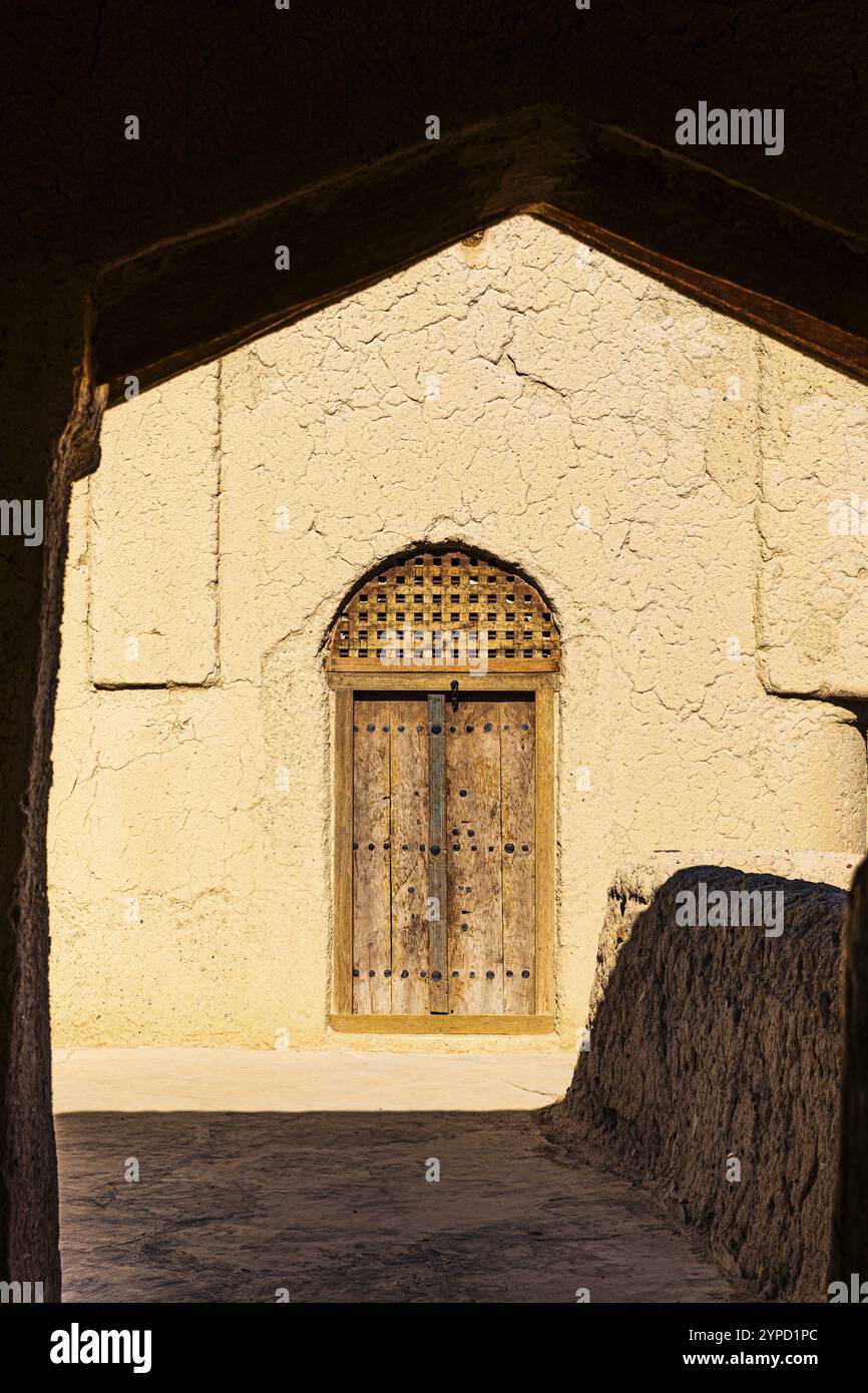Decorated round arch entrance door in the largest preserved mud town in ...
