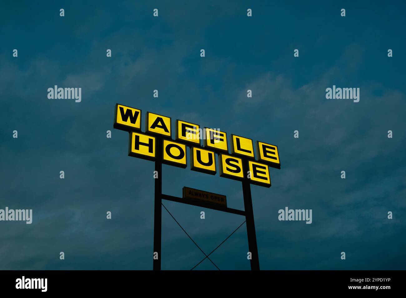 Waffle House sign against a cloudy dark sky in Florence, South Carolina ...