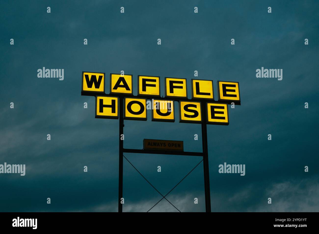 Waffle House sign against a cloudy dark sky in Florence, South Carolina ...