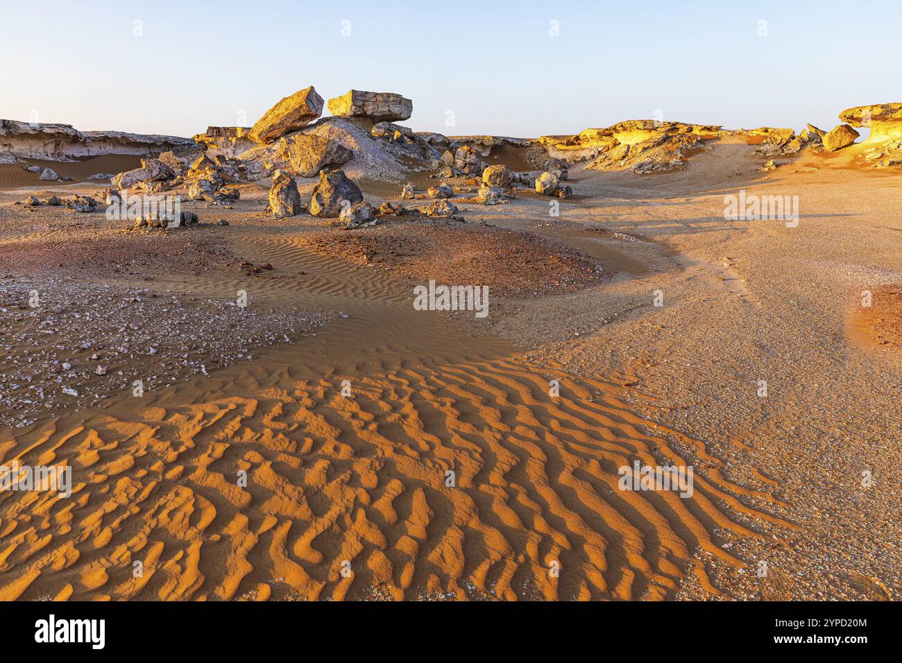 Striking cliffs surrounded by windswept sand structures, Huqf stone ...