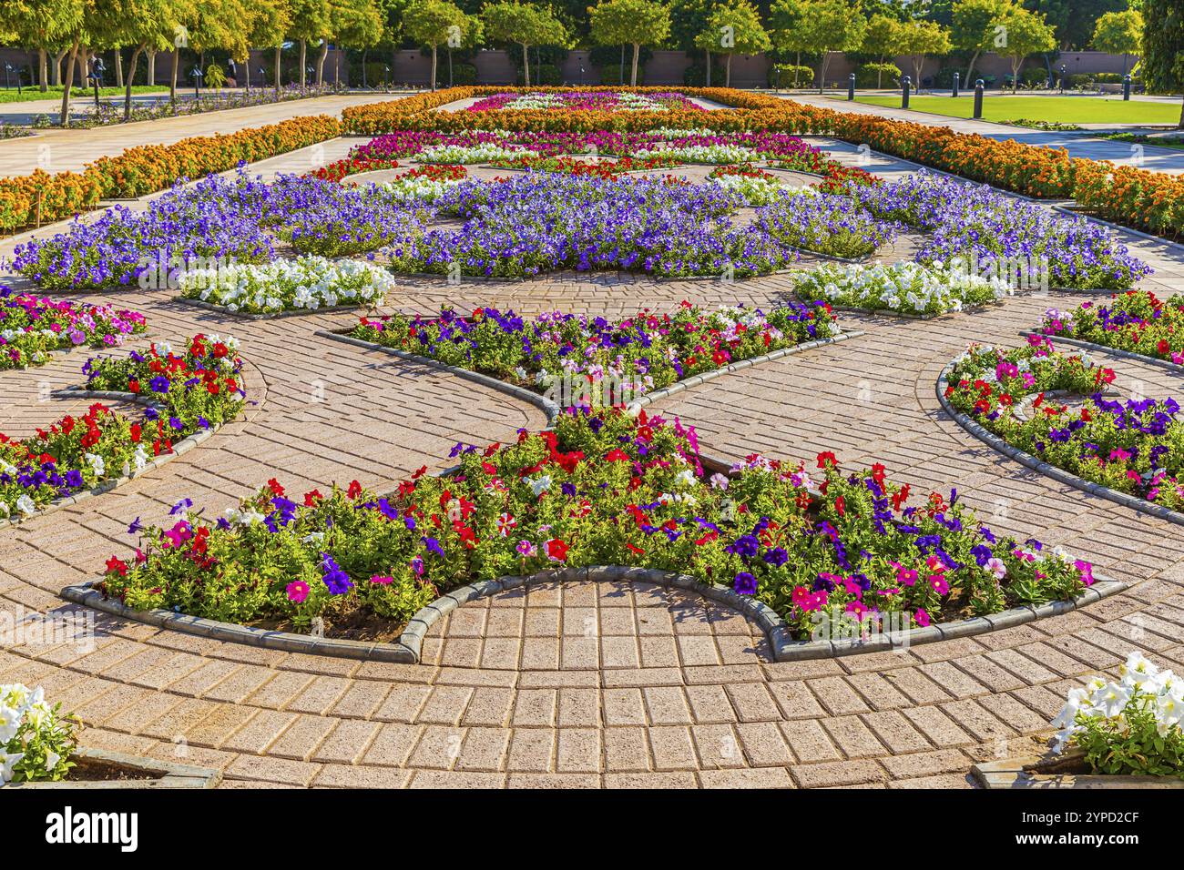 Park decorated with flowers in front of the Sultan Qaboos Mosque ...