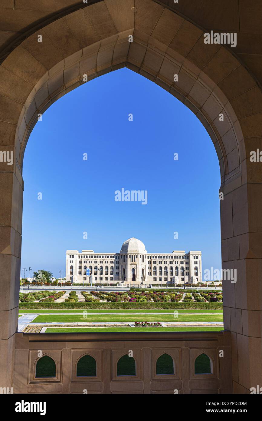Round arch of the Sultan Qaboos mosque with a view of the Supreme Court ...