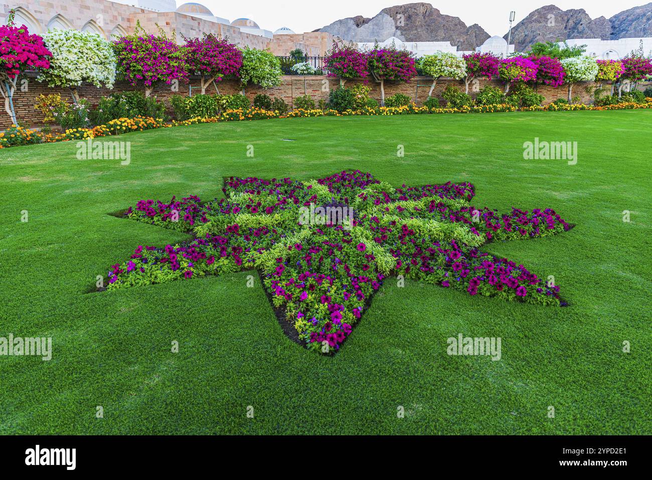 Park with green lawn, flowers and colourful bushes at Sultanspala ...