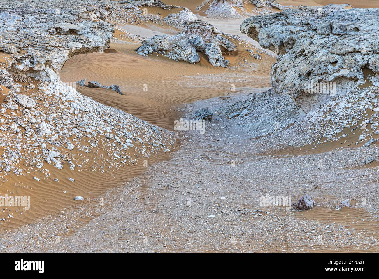 Striking cliffs surrounded by windswept sand structures, Huqf stone ...