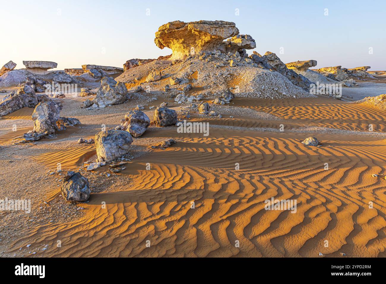 Striking cliffs surrounded by windswept sand structures, Huqf stone ...