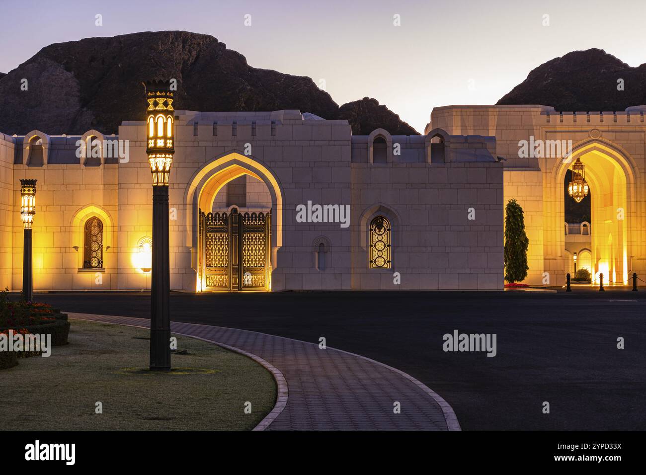 Illuminated side wing of the Sultan's Palace at dawn, Muscat, Arabian ...