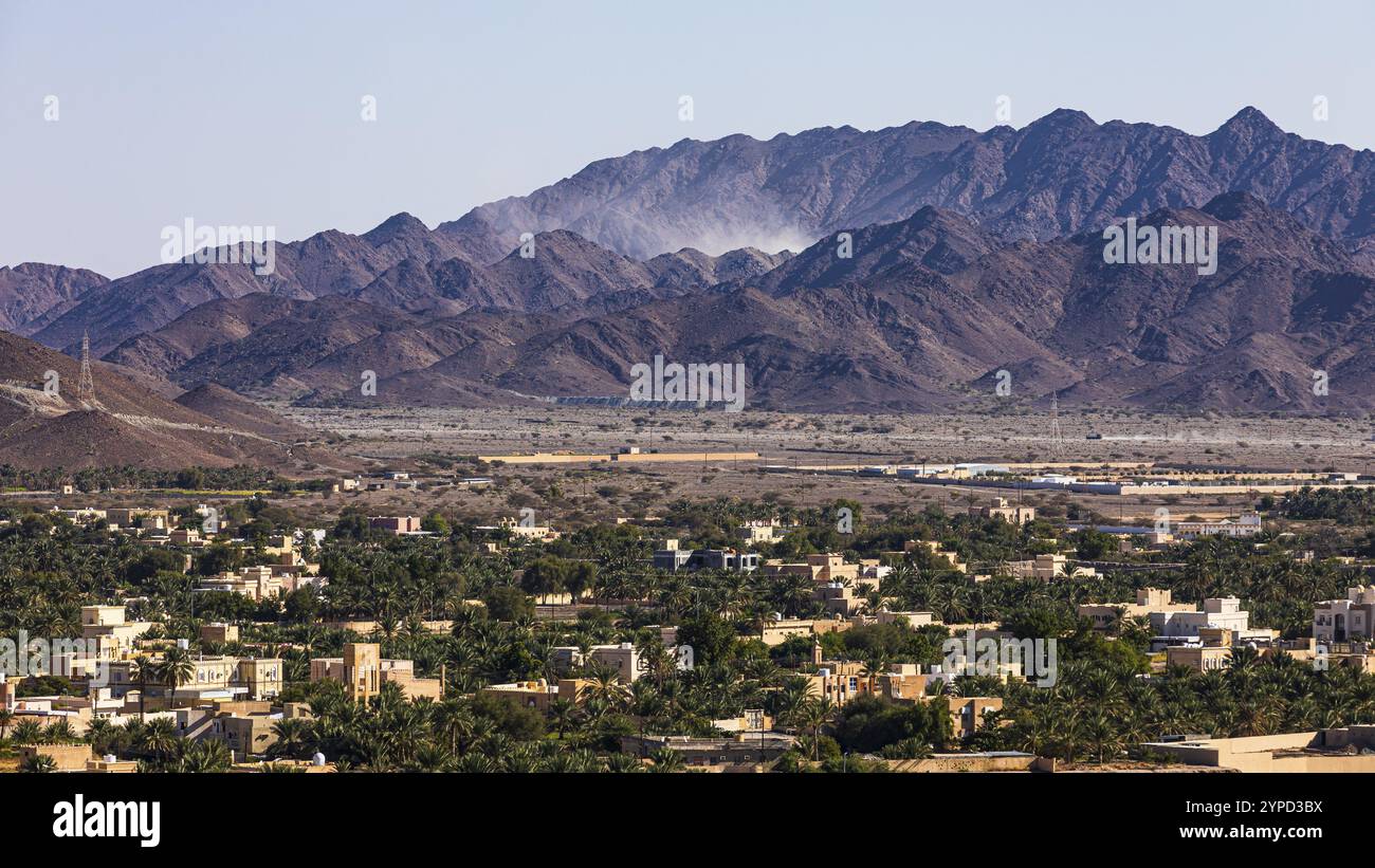 View of the city of Bahla, with the mountains of Jebel Akhdar in the ...