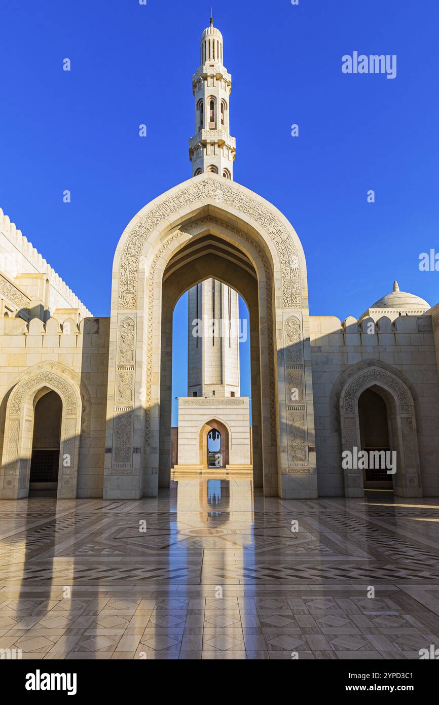 Arched gates with minaret at the Sultan Qaboos Mosque, Muscat, Arabian ...